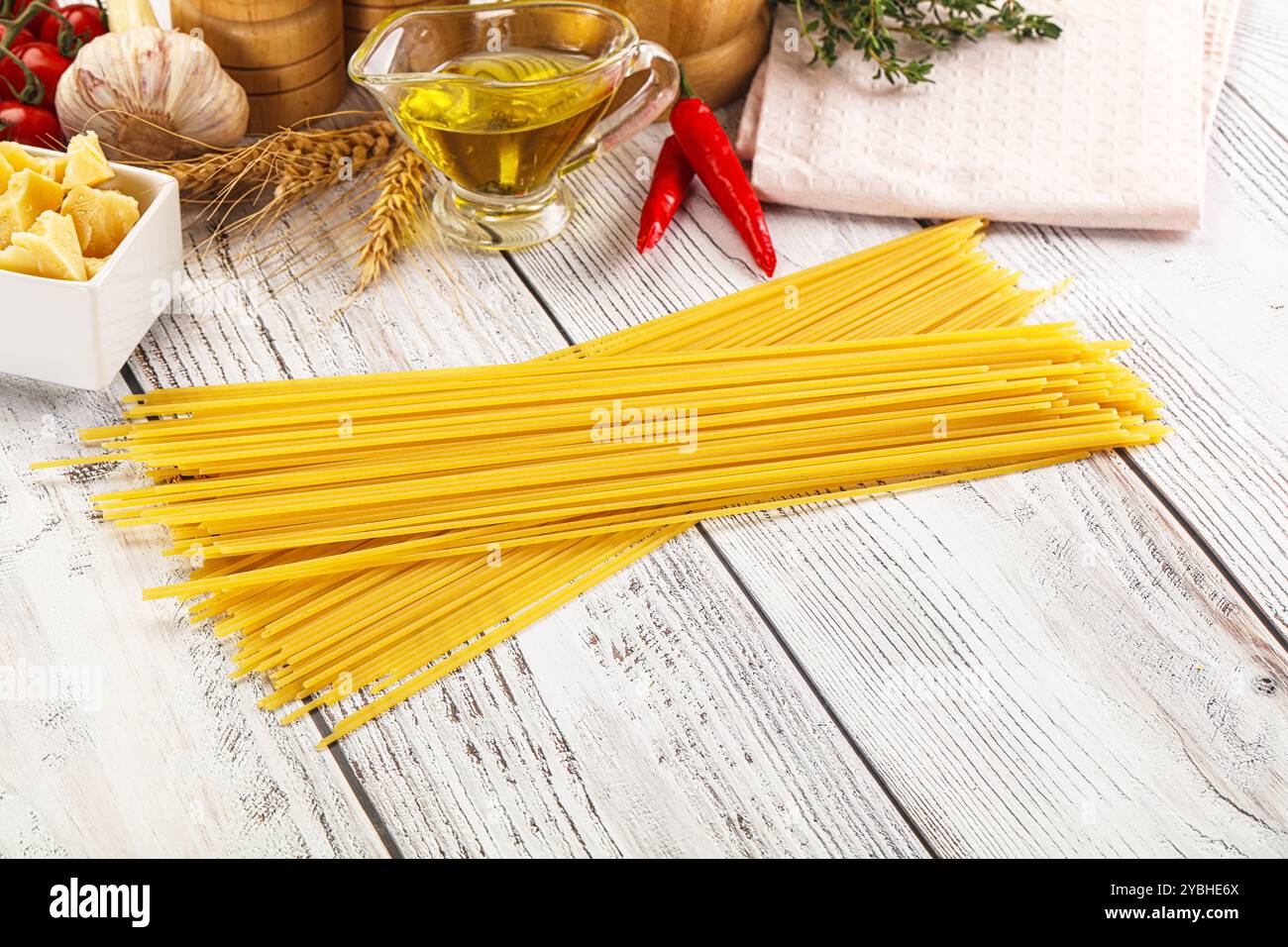 Raw dry Italian pasta - spaghetti for bowl Stock Photo - Alamy