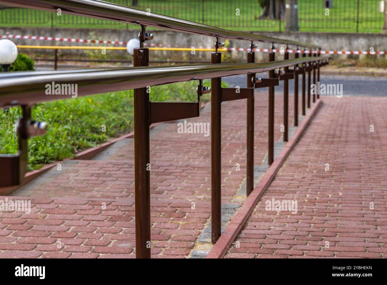 Ramp for wheelchair users, protective handrails on the ramp for people ...