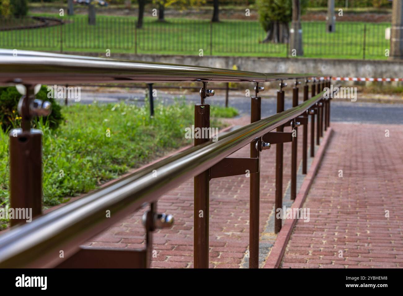 Ramp for wheelchair users, protective handrails on the ramp for people ...