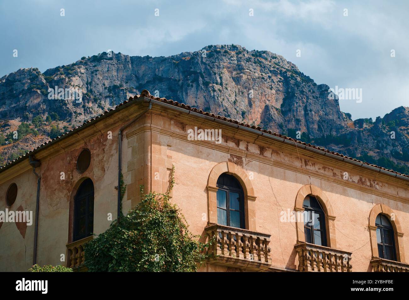 A beautiful historic stone building with arched windows and a scenic ...