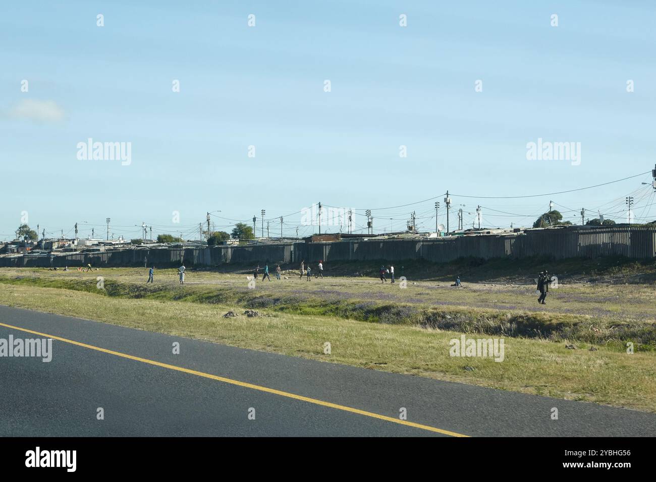 Informal settlement, people and street in city for poverty awareness ...