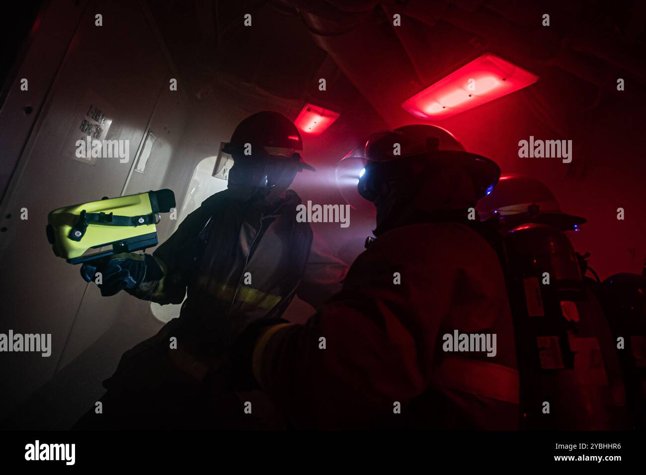 Sailors utilize a naval firefighting thermal imager while combating a ...