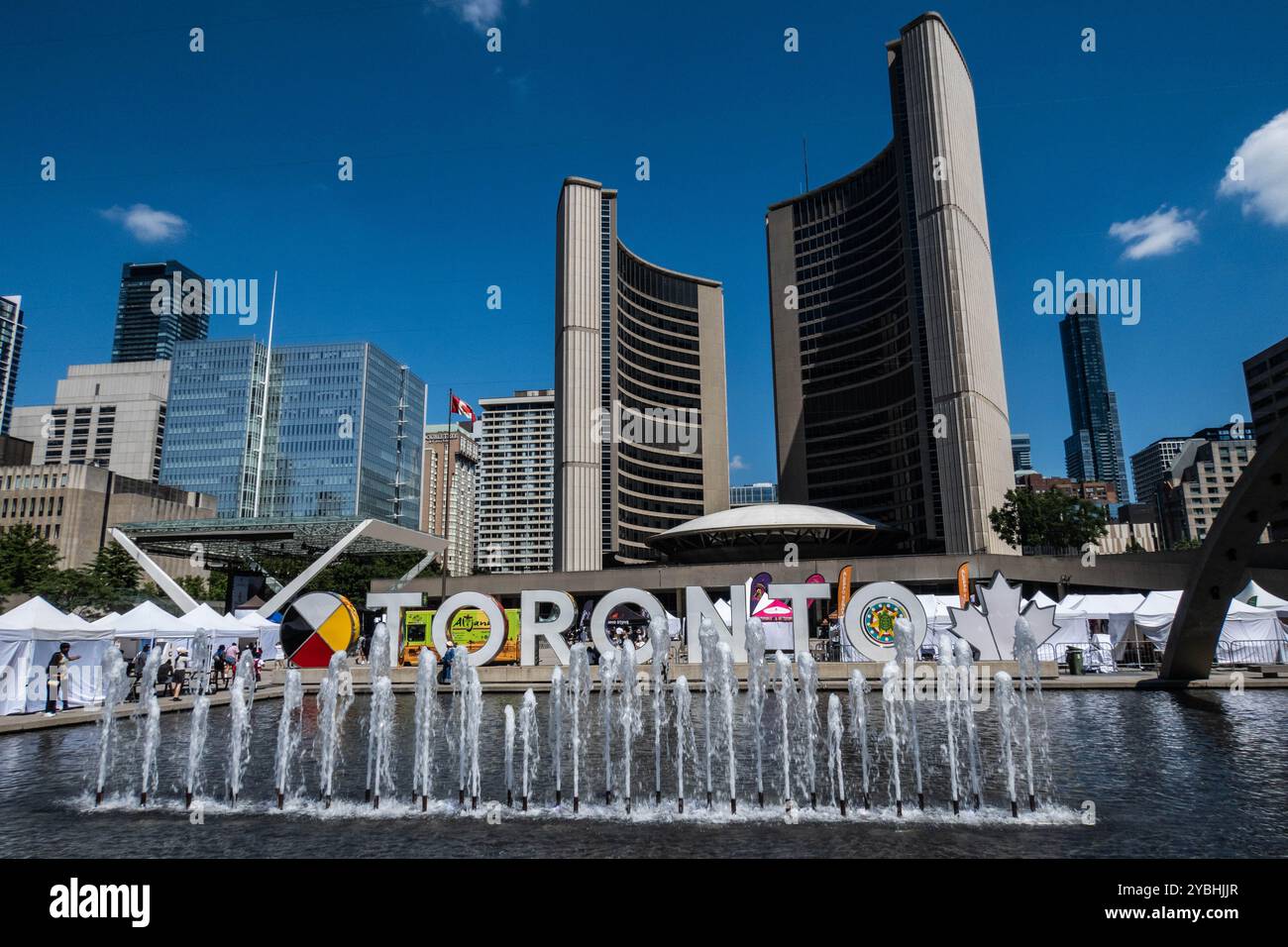 Toronto sign and Toronto City Hall in Nathan Phillips Square on Sunny ...