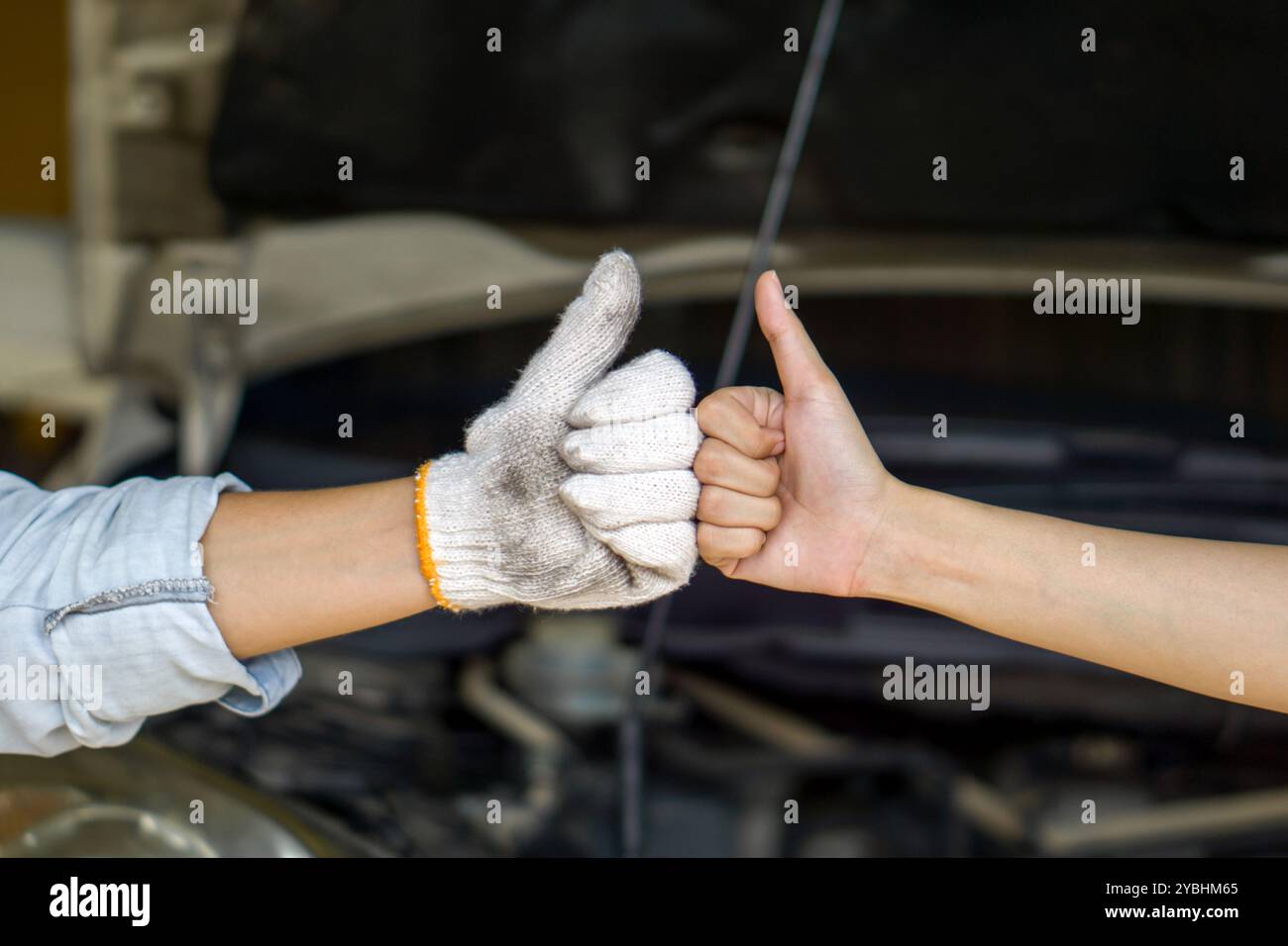 Close up two hands fist bump and thumb up showing success and good ...