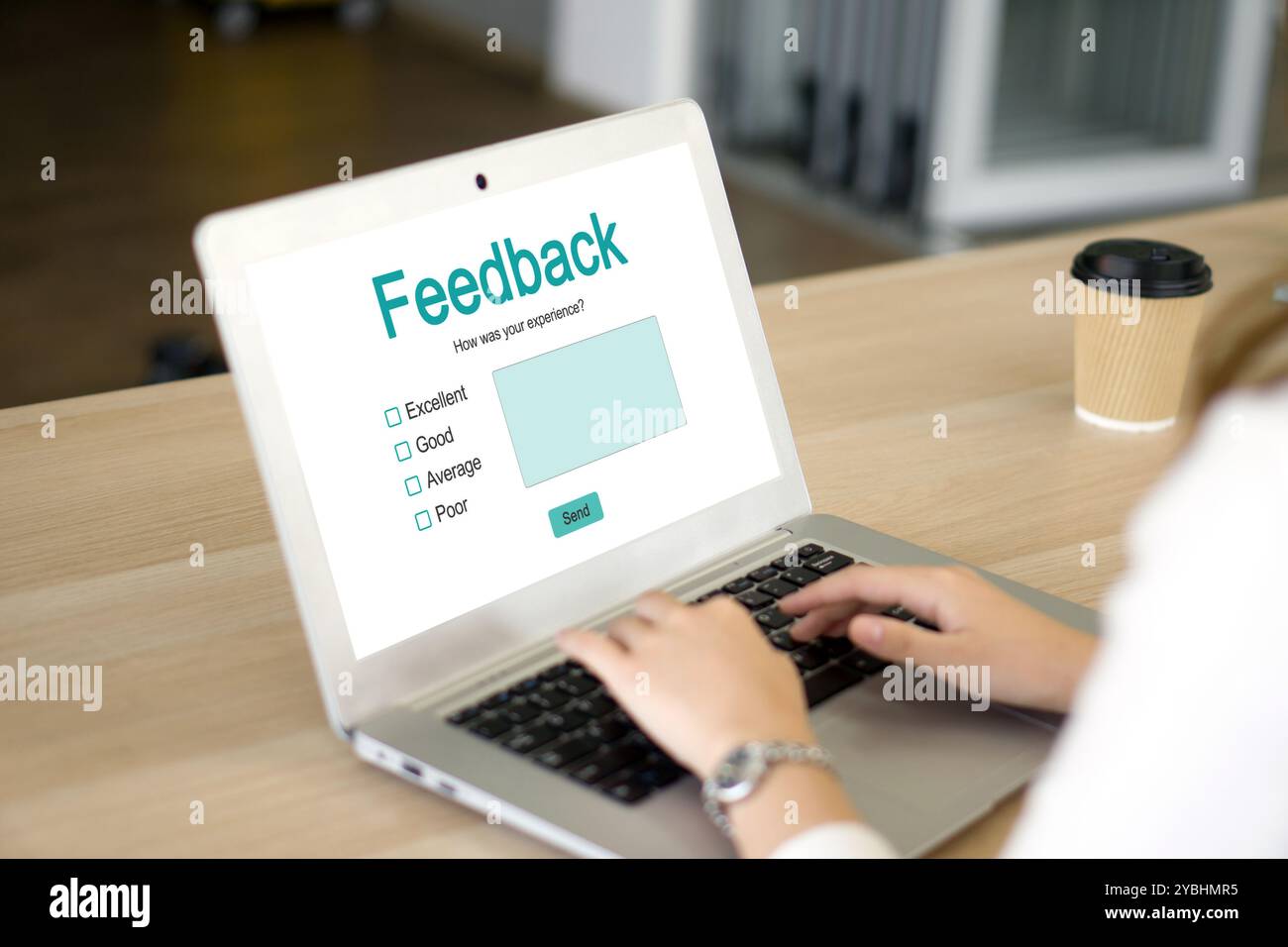 A lady is busy typing on her laptop computer which shows a feedback ...