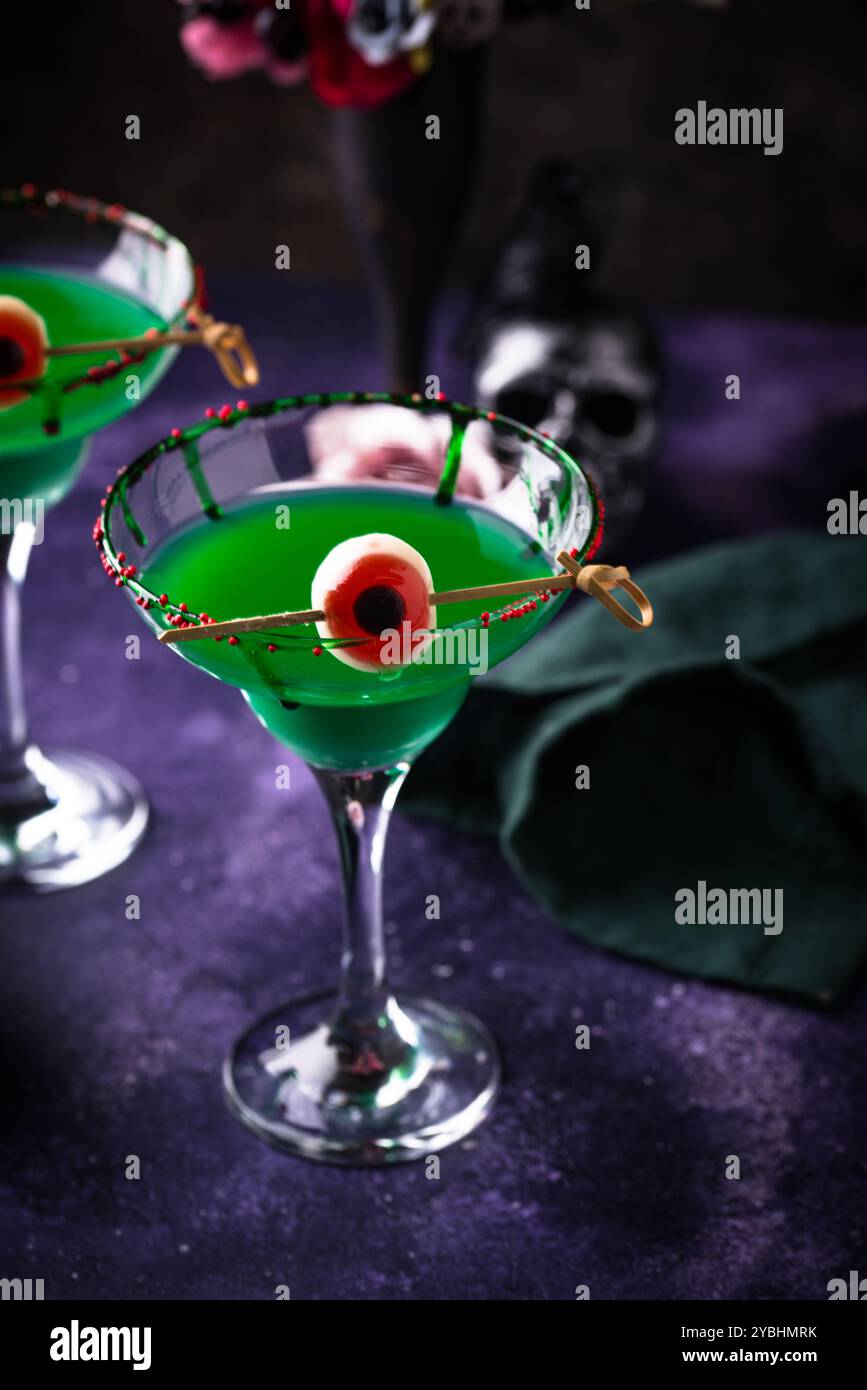 Spooky green halloween cocktail with eyeball Stock Photo - Alamy