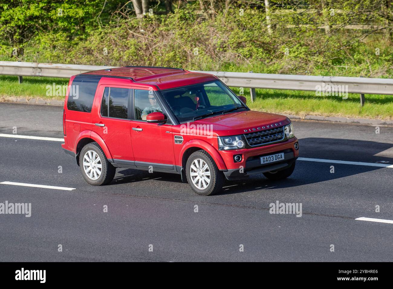 2013 Red Land Rover Discovery HSE SDV6 Auto car travelling on the M6 ...