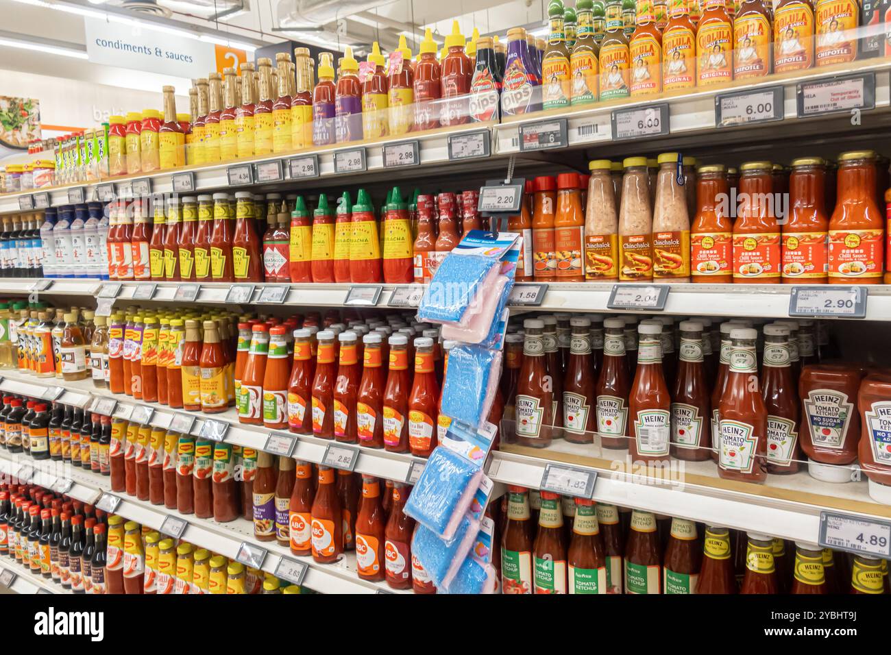 Ketchup, Sauces, condiments, bottles on shelves in FairPrice ...