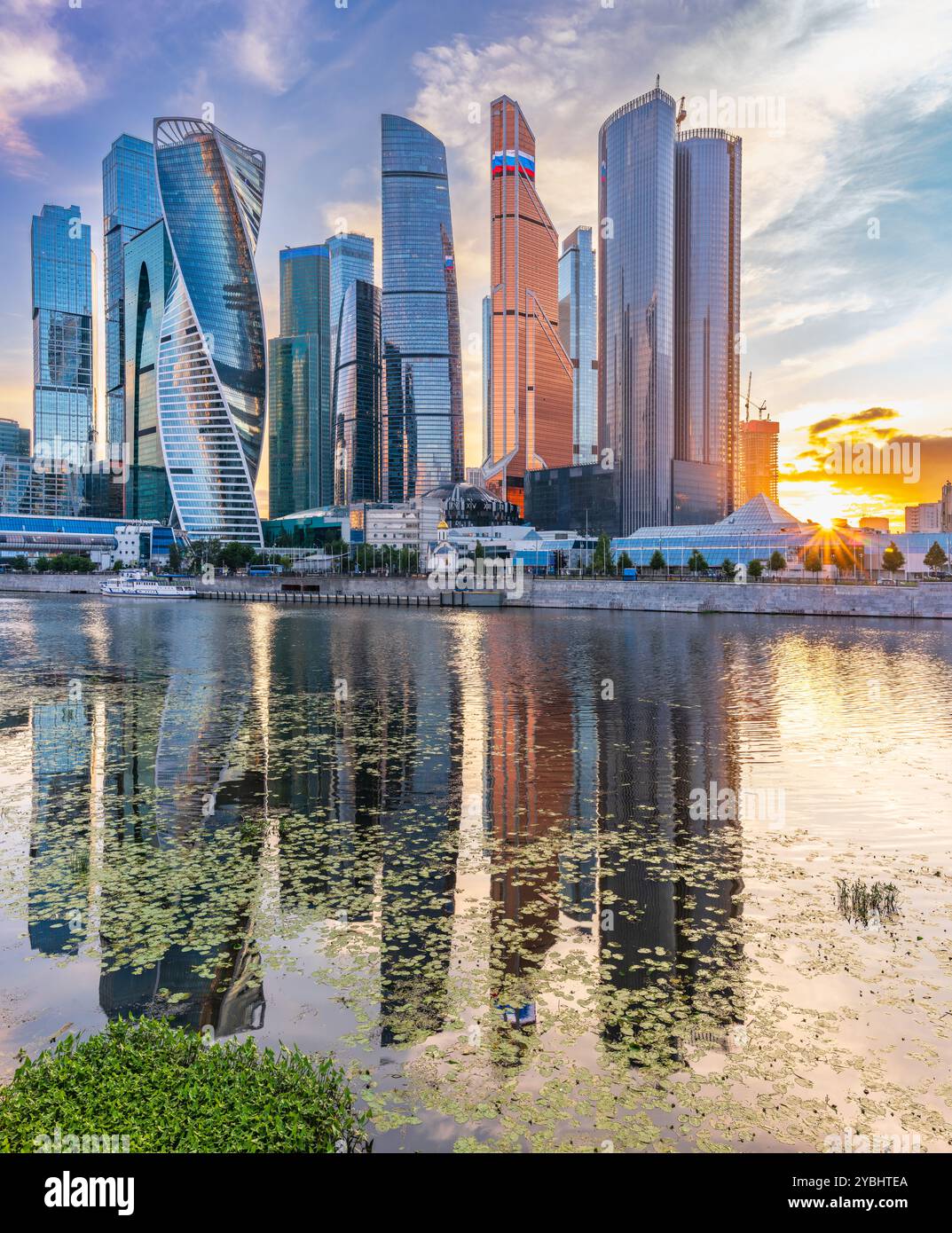 High buildings of Moscow-City at Moskva River at summer sunset, Russia ...