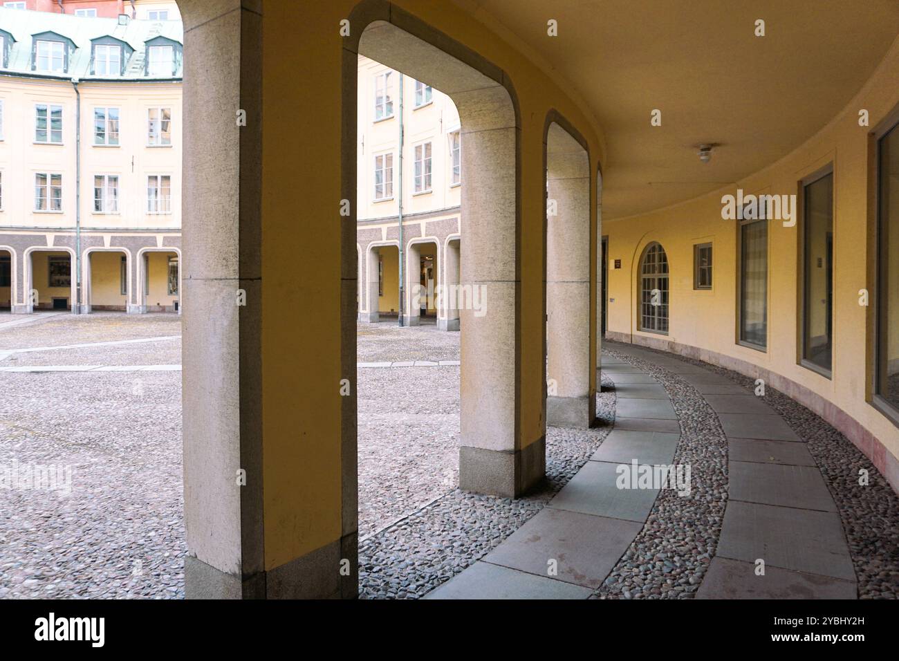 Pillars at the town square between the buildings Stock Photo - Alamy