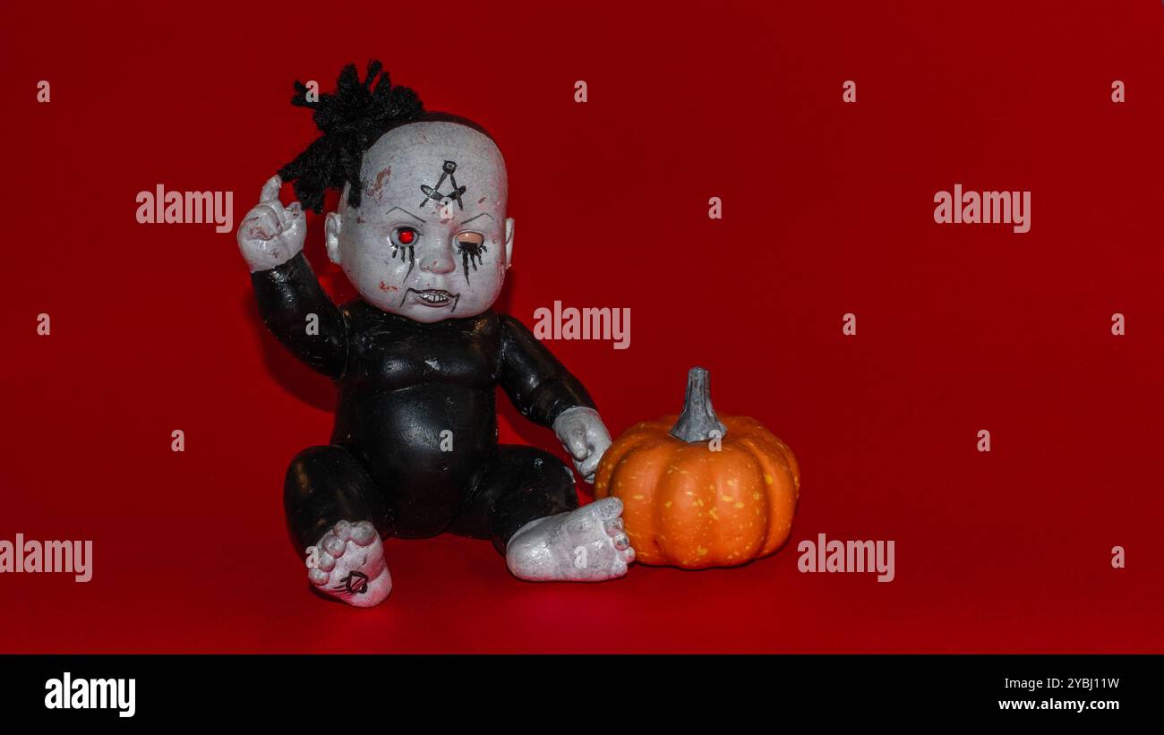 Pumpkin and sinister illuminati freemason puppet doll holding its hand ...