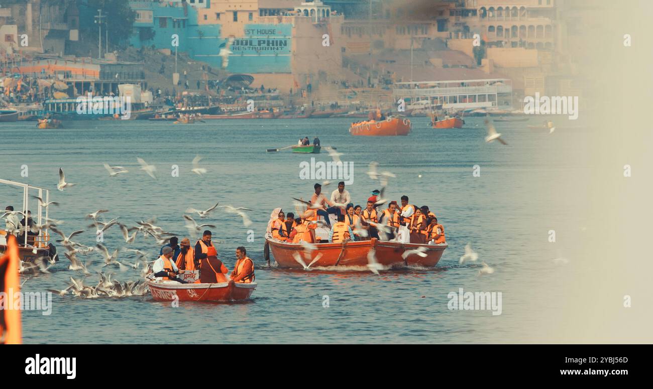 Varanasi, India. Tourists And Indian Pilgrims Floating On Ganga Riverbank. Tourists Boats ...