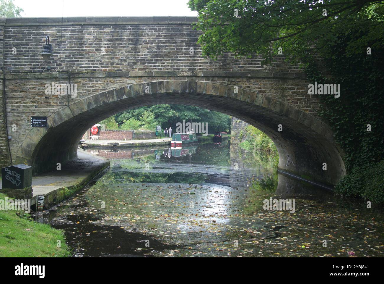Bridge over the Calder and Hebble Navigation, with narrowboat in the ...