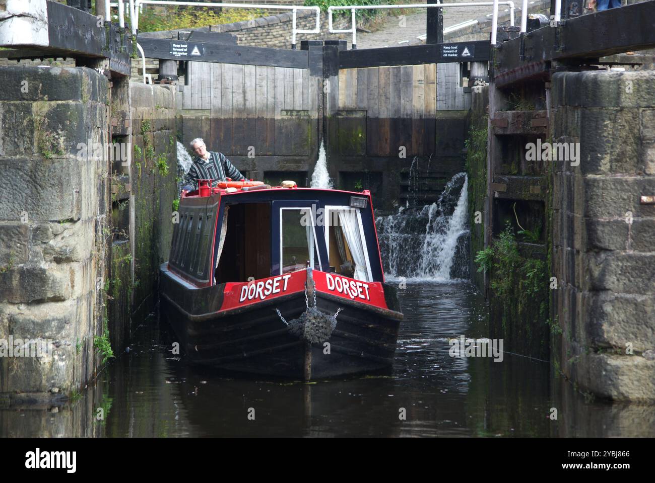 Narrowboat leaving a lock on the Calder and Hebble Navigation Stock ...