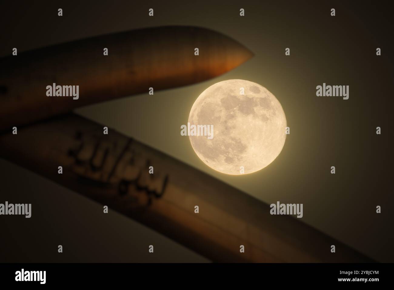The moon rises behind the crossed swords at the Grand Festivities ...