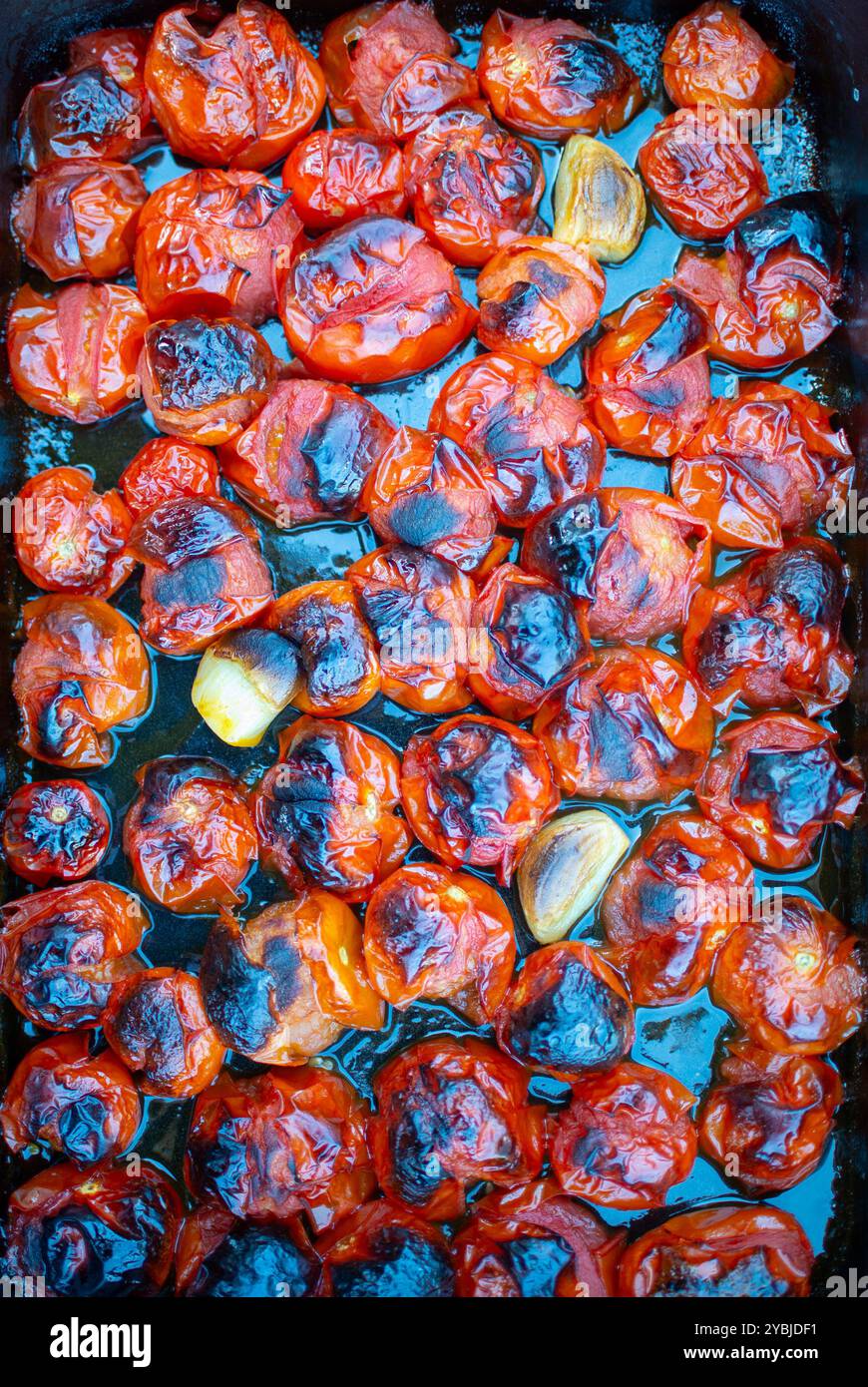 Roasted tomatoes with Garlic Stock Photo - Alamy