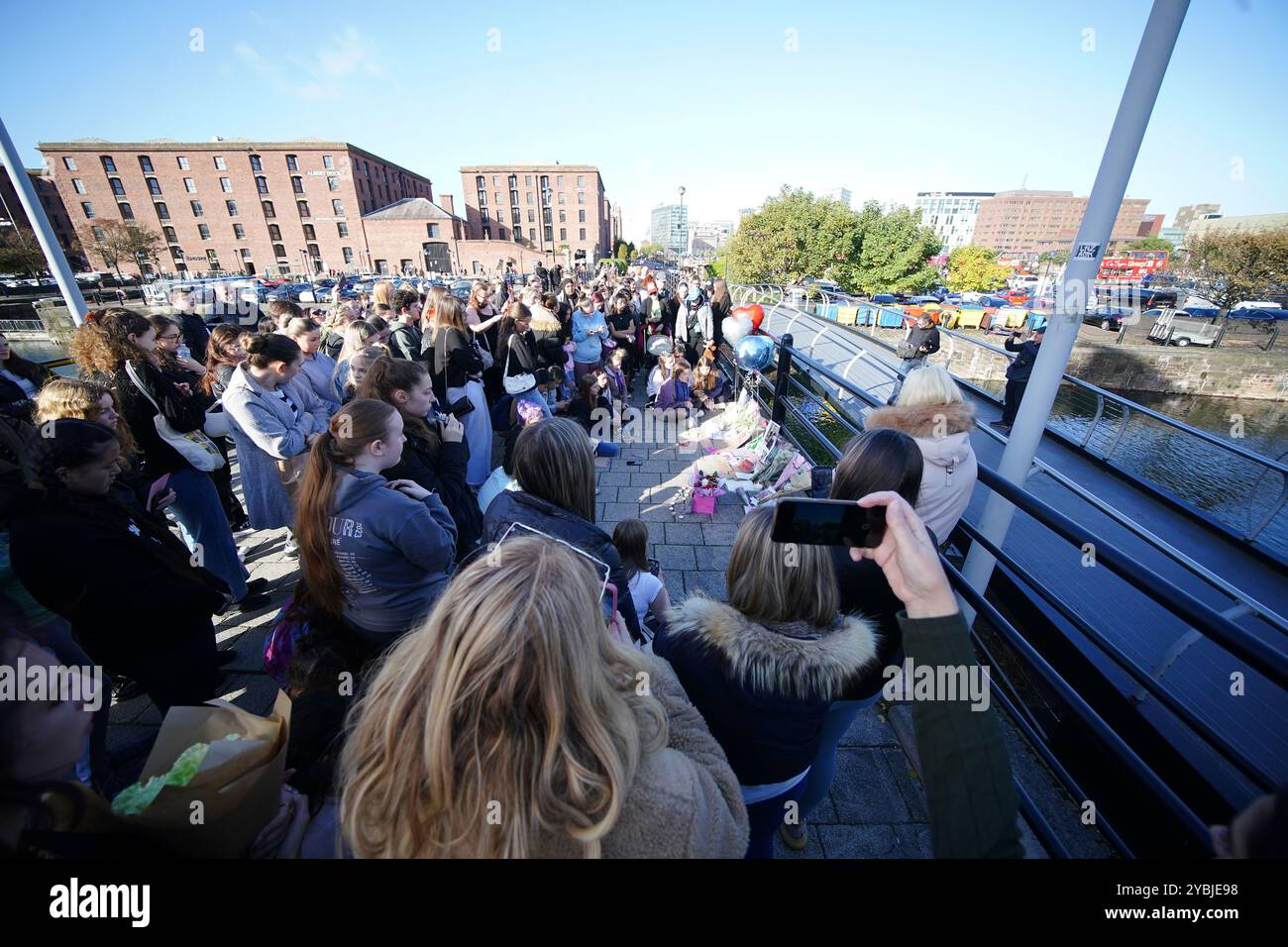 People attend a vigil for 31-year-old singer Liam Payne from ...