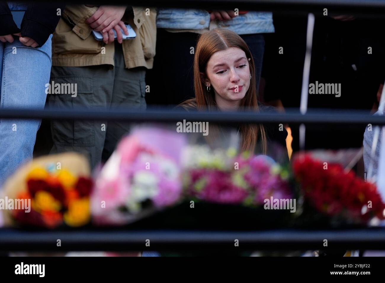 People attend a vigil for 31-year-old singer Liam Payne from ...