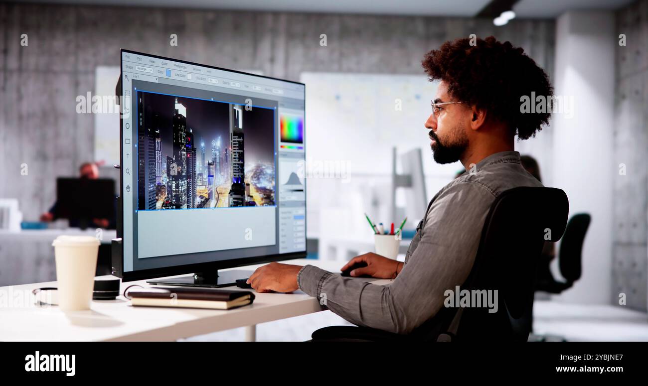 African Graphic Web Designer Using Design Editing Software Stock Photo ...