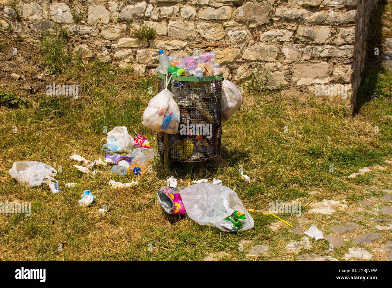 Berat, Albania-June 2 2024.Overflowing rubbish and litter highlighting ...