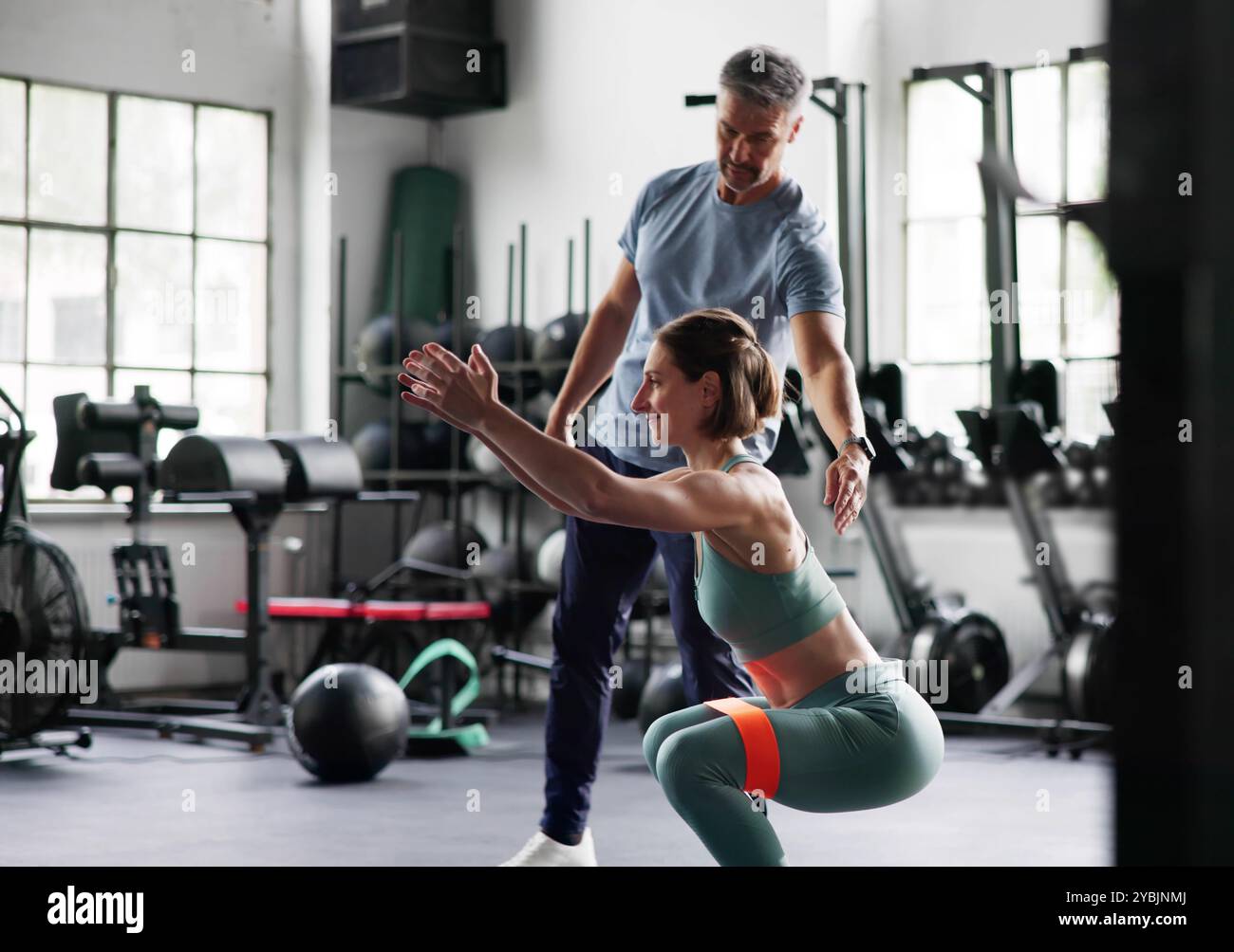 Personal trainer showing training hi-res stock photography and images ...