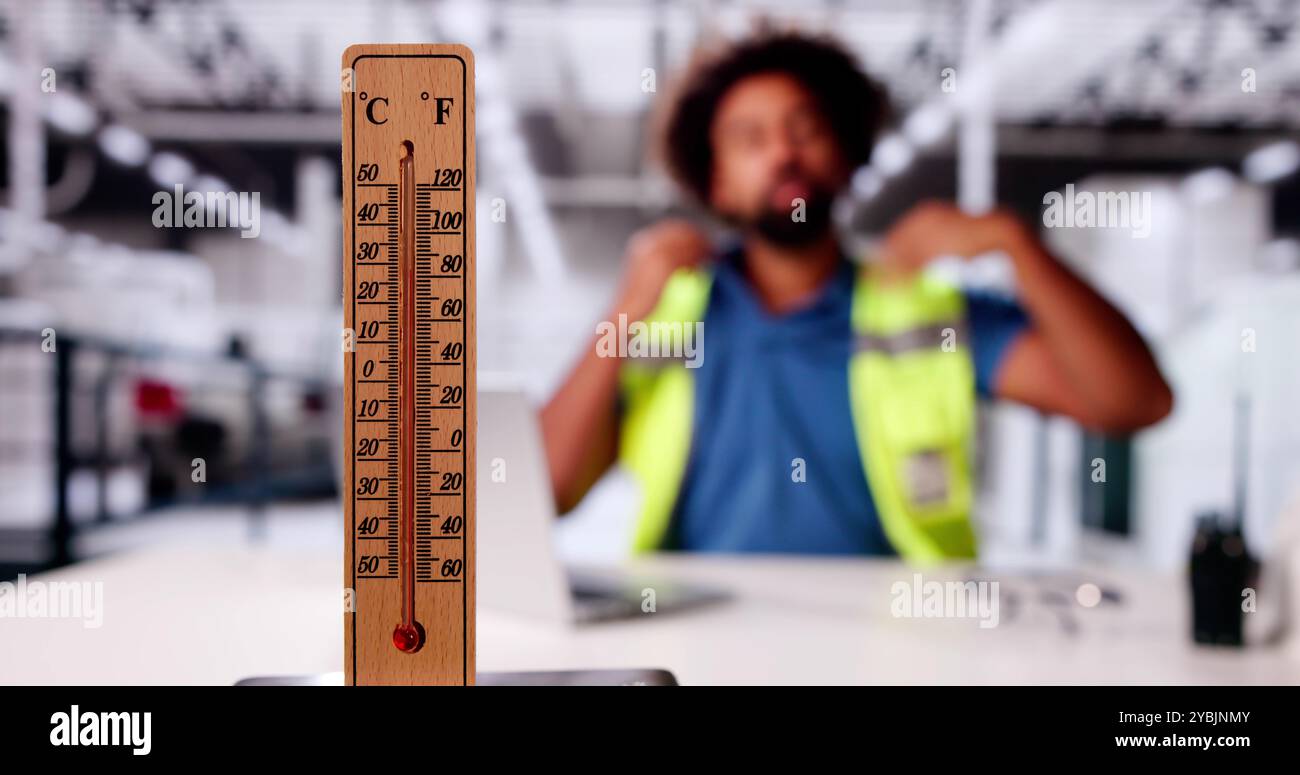 Hot Weather Temperature Rise At Factory. Sweating Worker Stock Photo ...