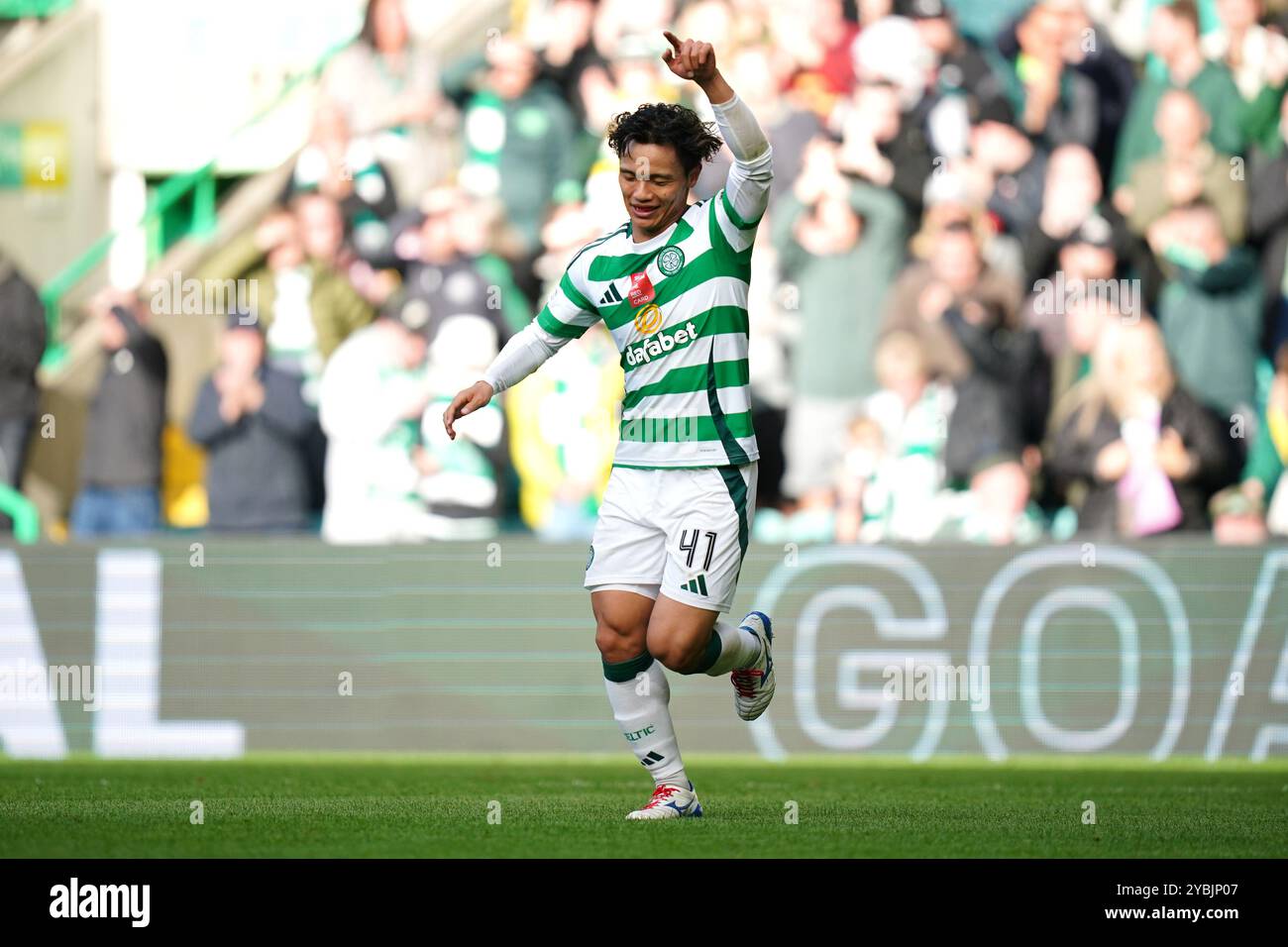 Celtic's Reo Hatate celebrates scoring their side's first goal of the ...