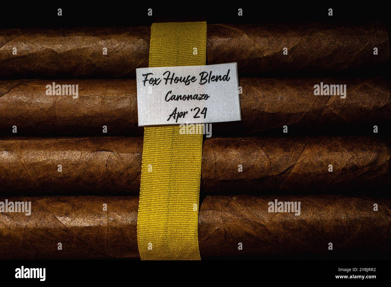 Bundles of cigars in the humidor room with constant humidity and ...