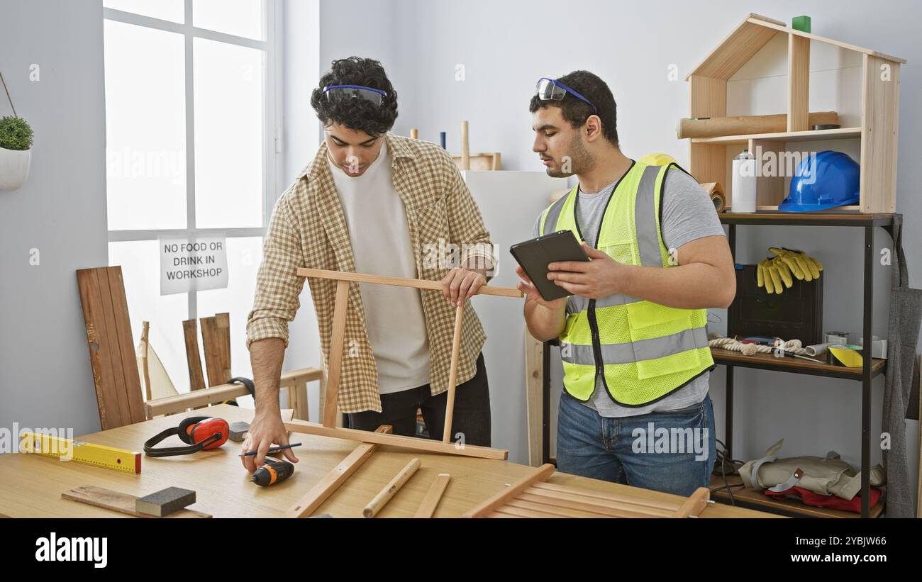 Two construction workers measuring hi-res stock photography and images ...