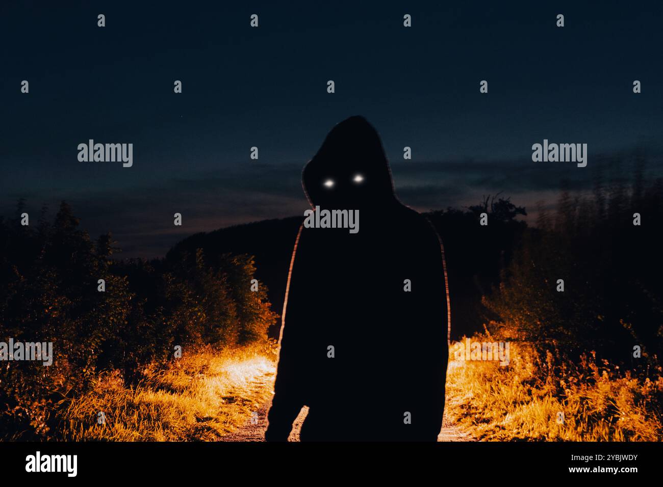 Scary hooded figure glowing hi-res stock photography and images - Alamy