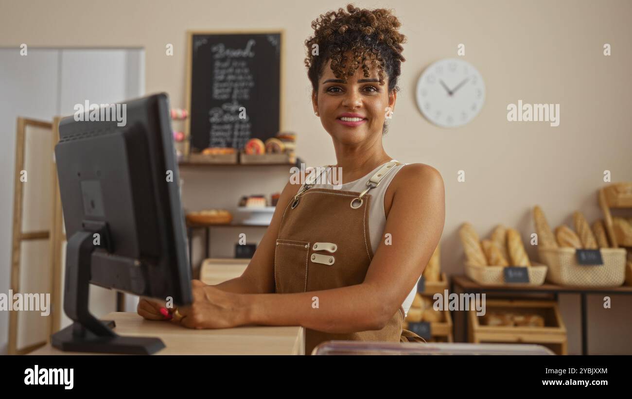 Woman smiling behind bakery counter hi-res stock photography and images ...