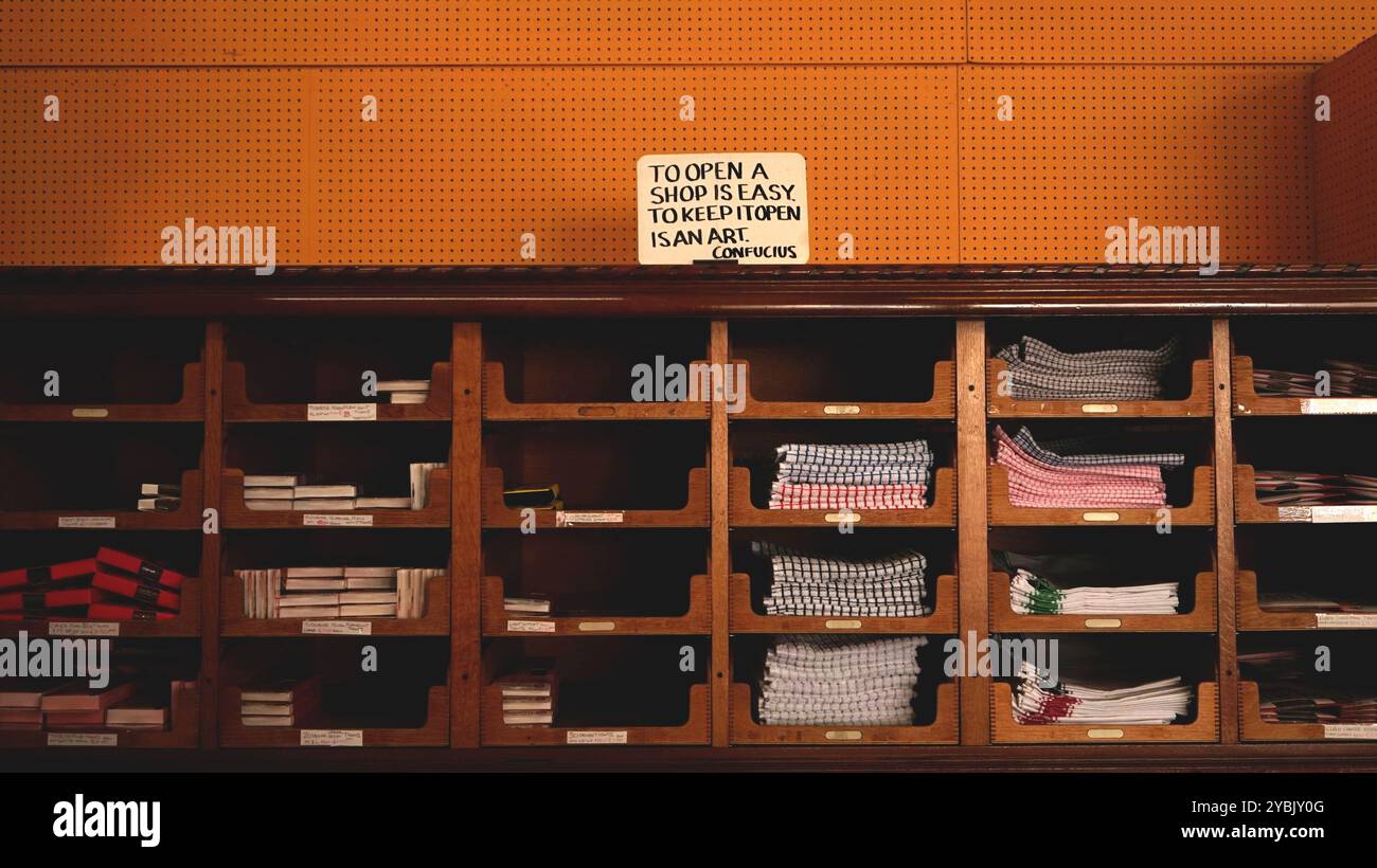 Old retail shop interior, 1930s shelving with linen drapery, teatowels ...