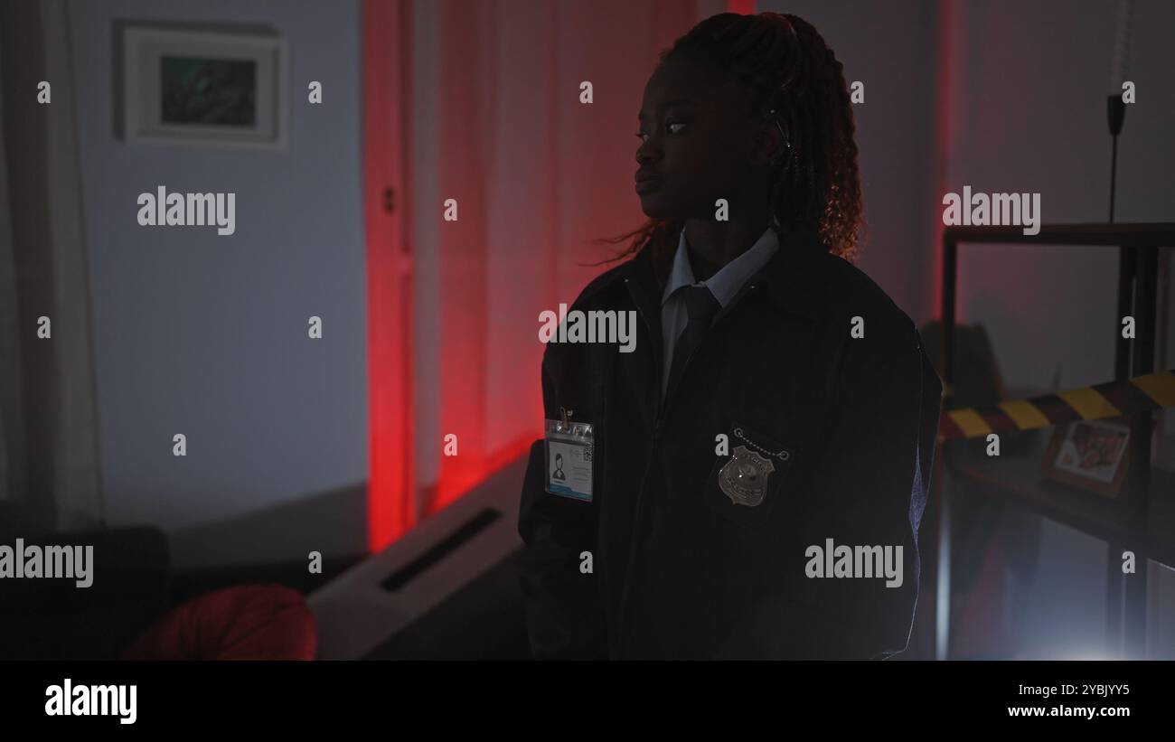 African american detective woman investigates a dark indoor crime scene ...