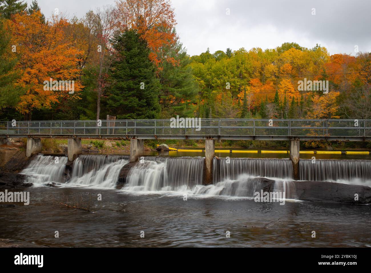 Bridge spanning river along hiking trail at Wilson Falls Stock Photo ...