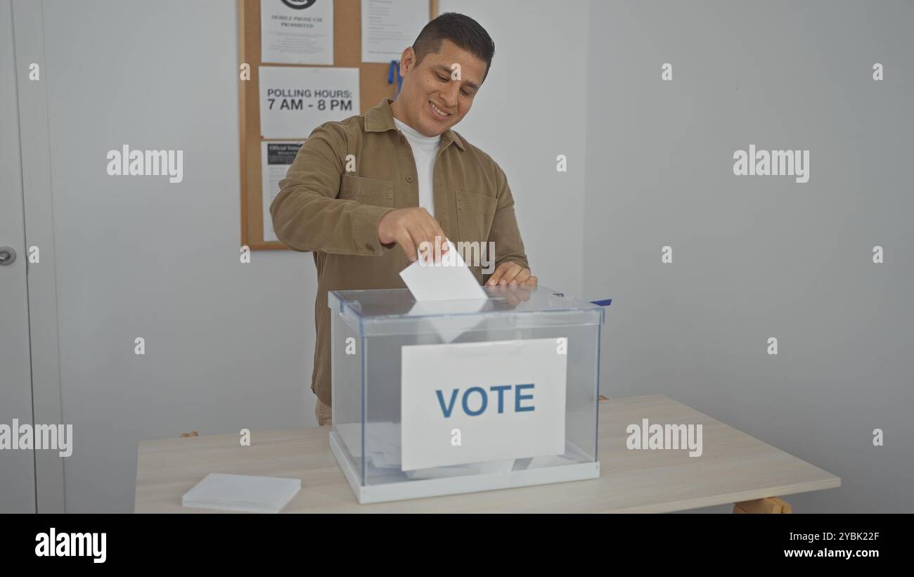 Hispanic man smiling as he casts vote in a polling station with a 'vote ...