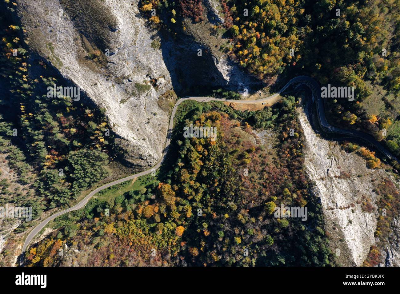 Aerial top down view of deep canyon, gorge road in autumn forest by ...