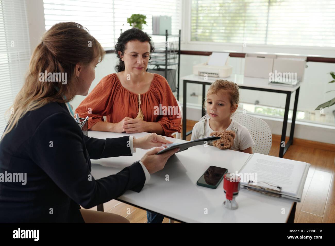 Social Worker Explaining Adoption Agreement Stock Photo - Alamy