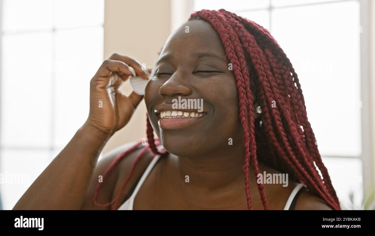 Young energetic black woman braids hi-res stock photography and images ...