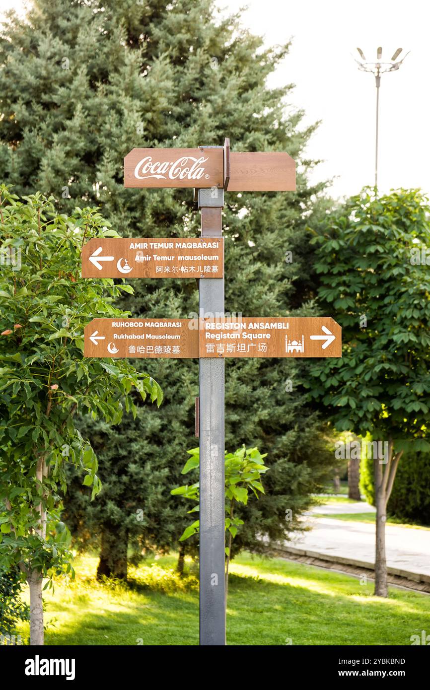 Samarkand, Uzbekistan - 05 July 2024: Tourist spot sign and Coca Cola ...