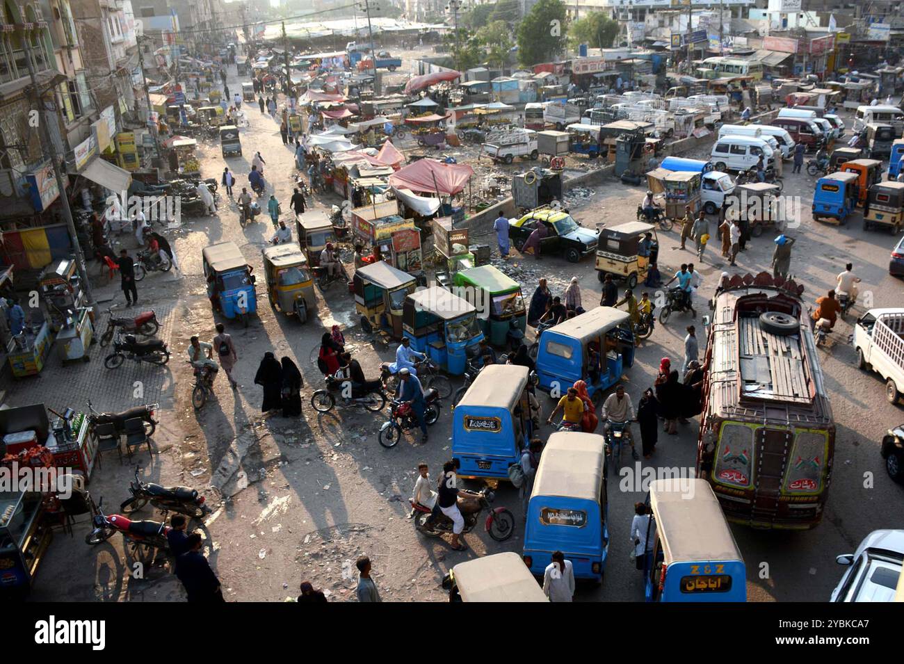 View of illegal encroachment on the road and footpath creating problems ...