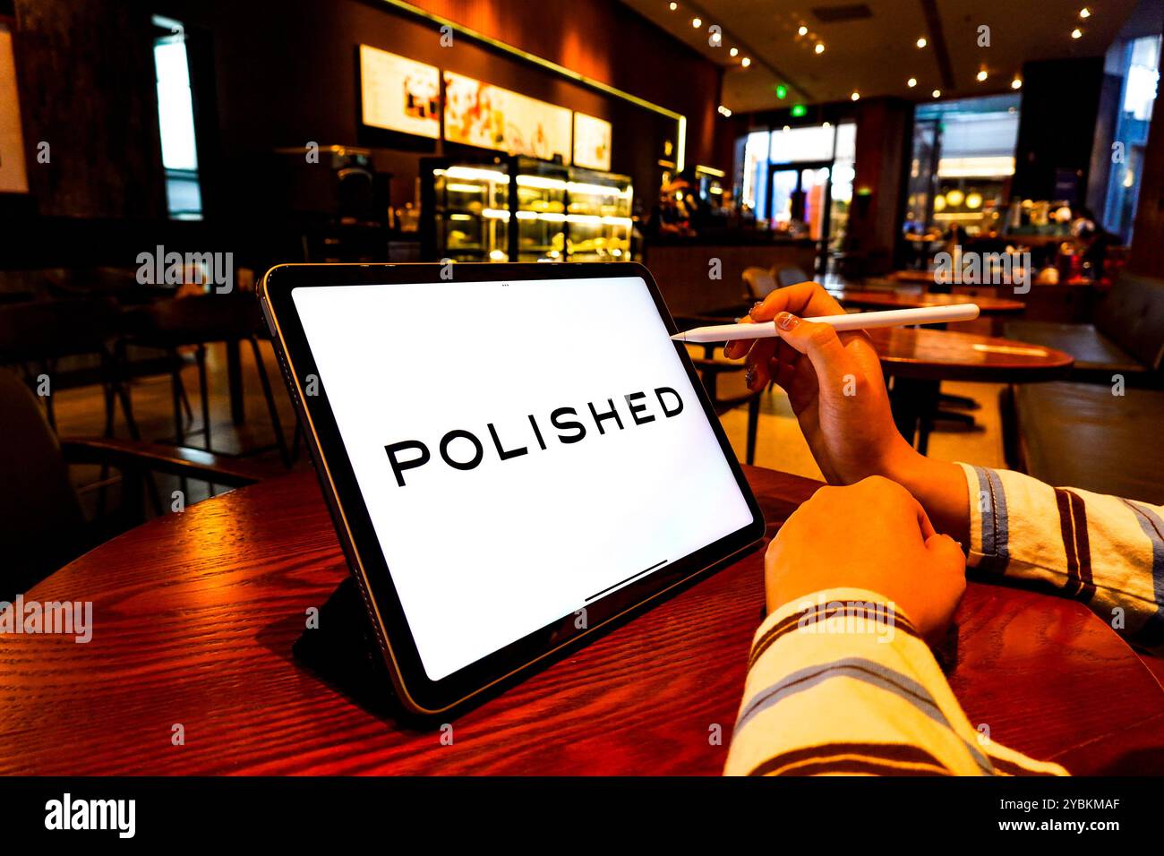 In this photo illustration, a Revolve logo is displayed on the screen ...