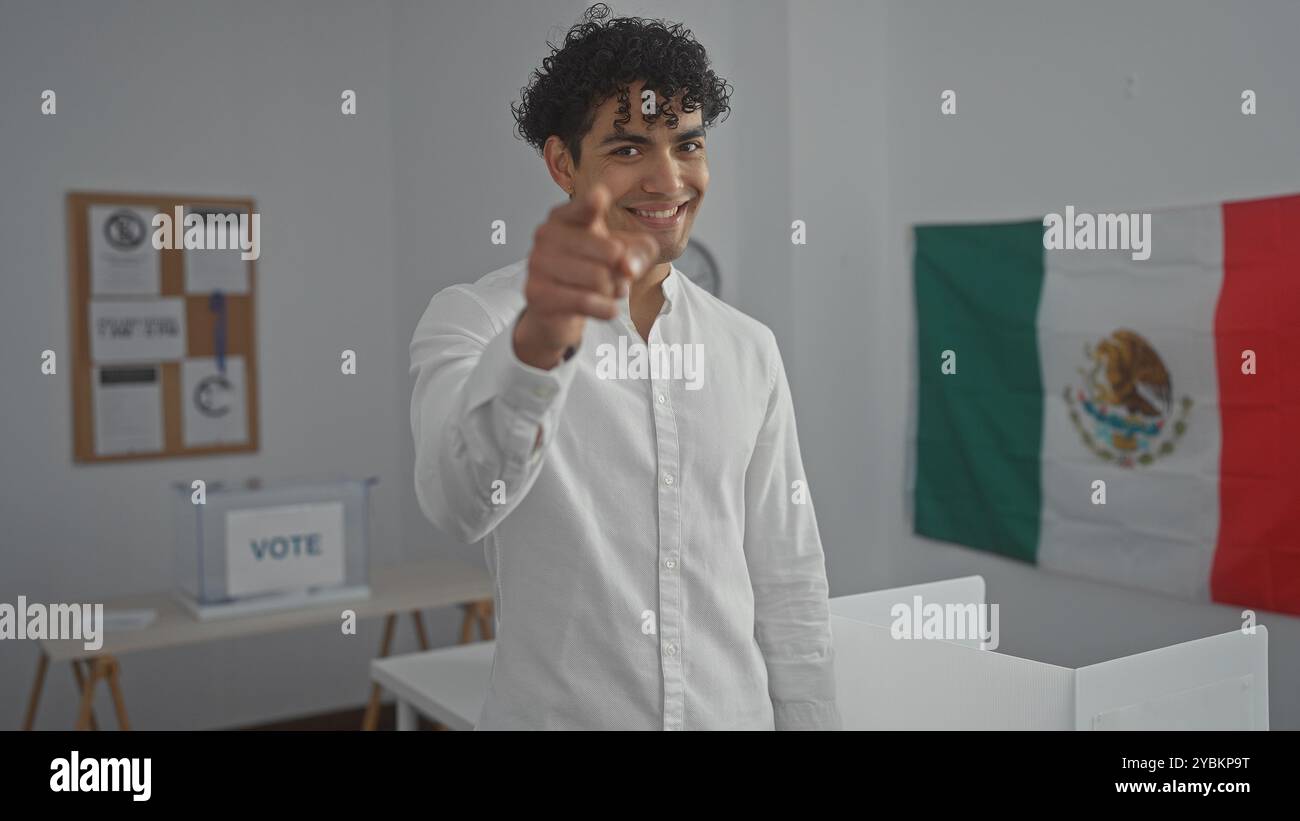 Smiling young hispanic man pointing, wearing a white shirt in a voting ...