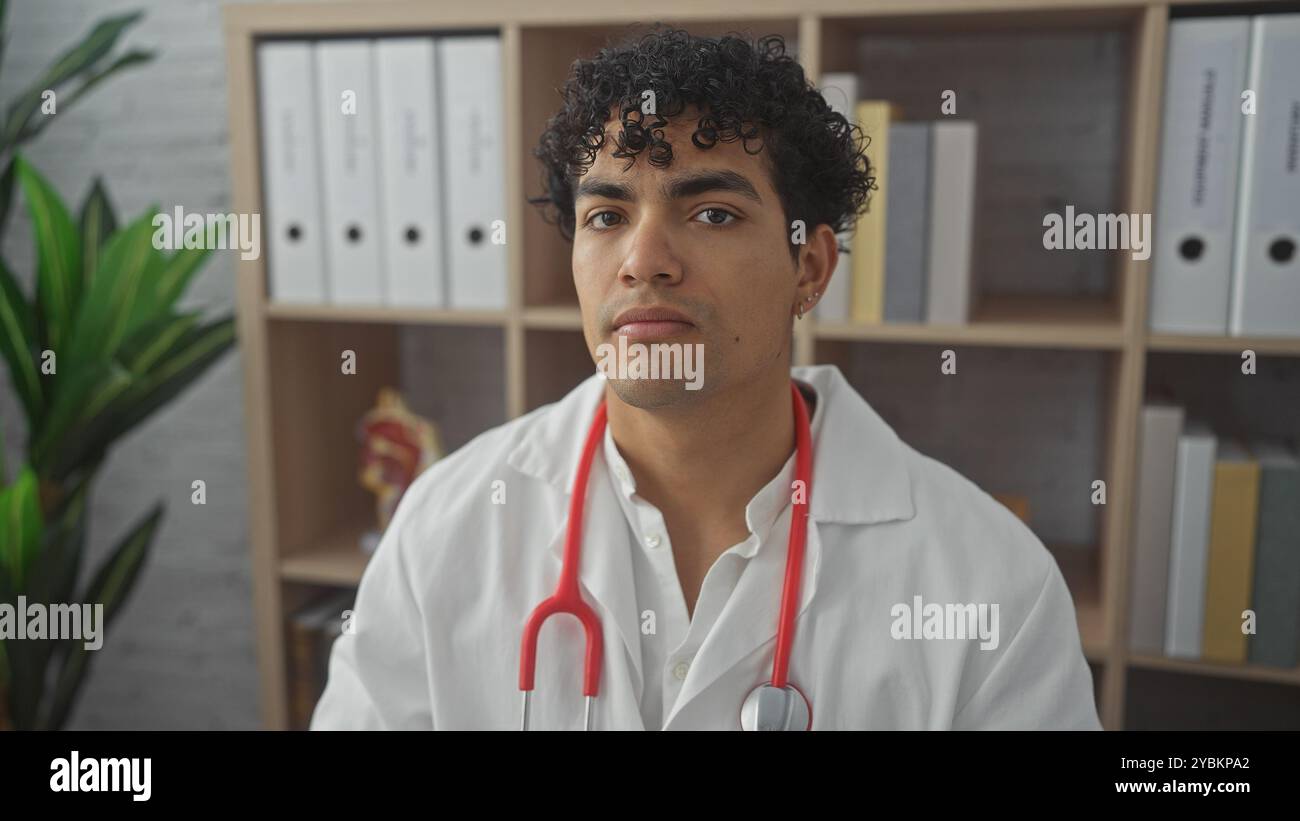 A confident young hispanic male doctor with curly hair, wearing a ...