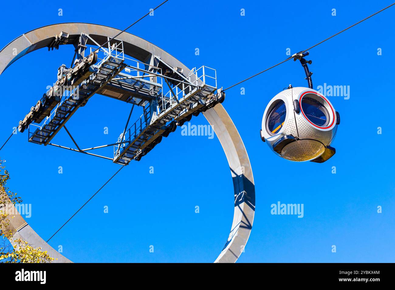 a cable car with round passenger cabins. aerial tram station. High ...