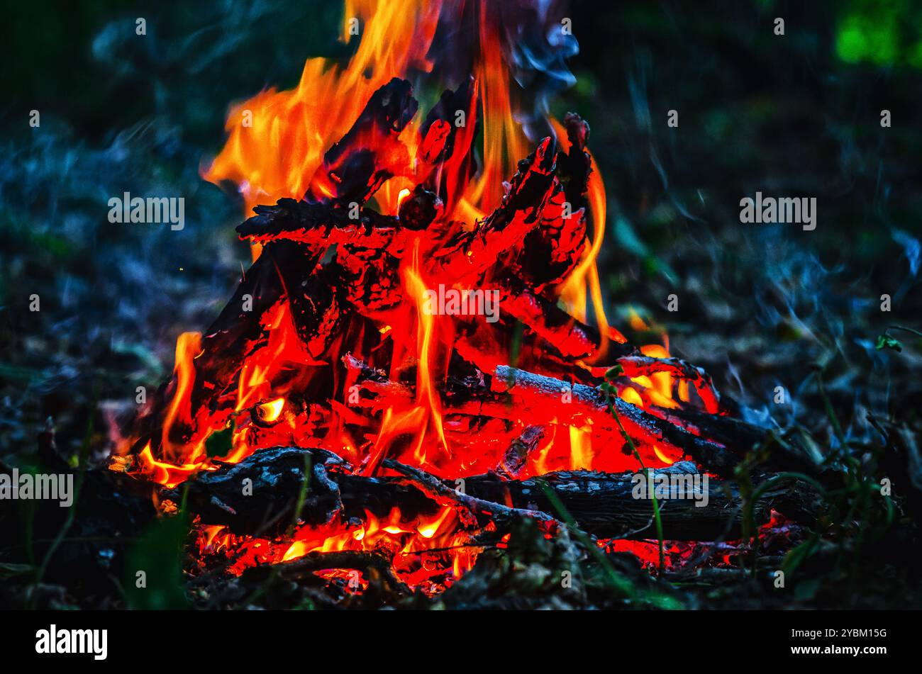 Tongues flame against black background hi-res stock photography and ...