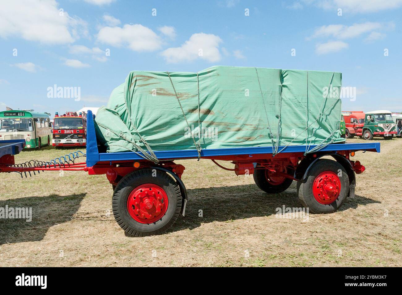 A blue trailer with sheeted load being pulled by an AEC Mamoth Major at ...