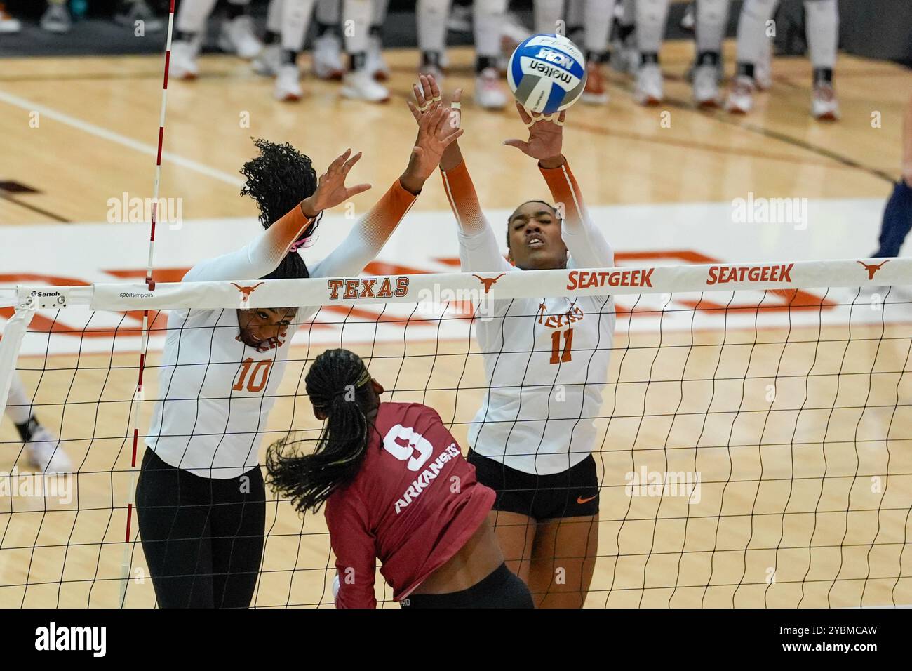 Texas opposite hitter Reagan Rutherford (10) and middle blocker ...