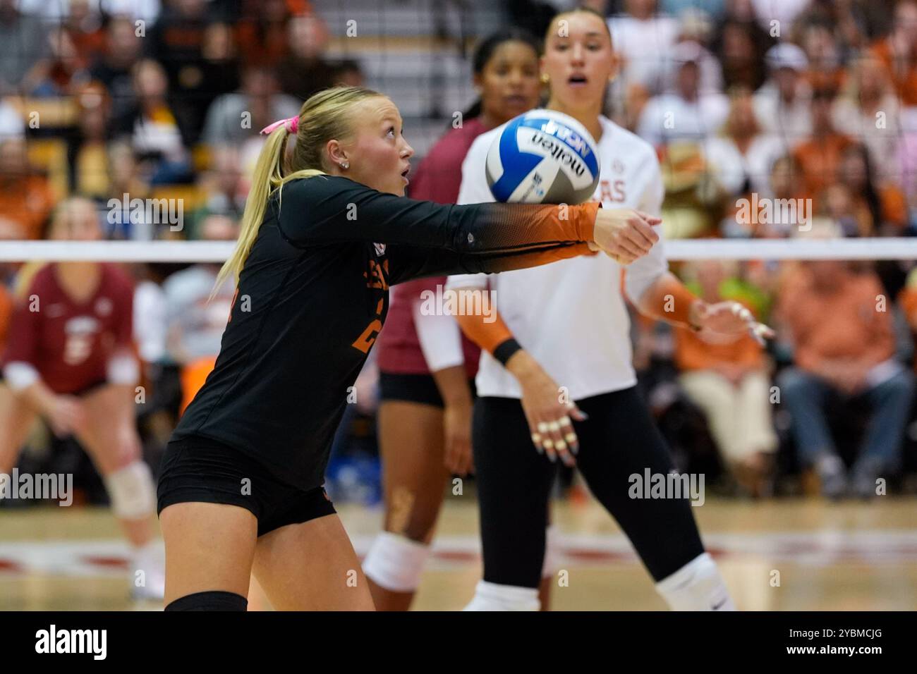 Texas libero Emma Halter (2) digs the ball as Texas outside hitter ...
