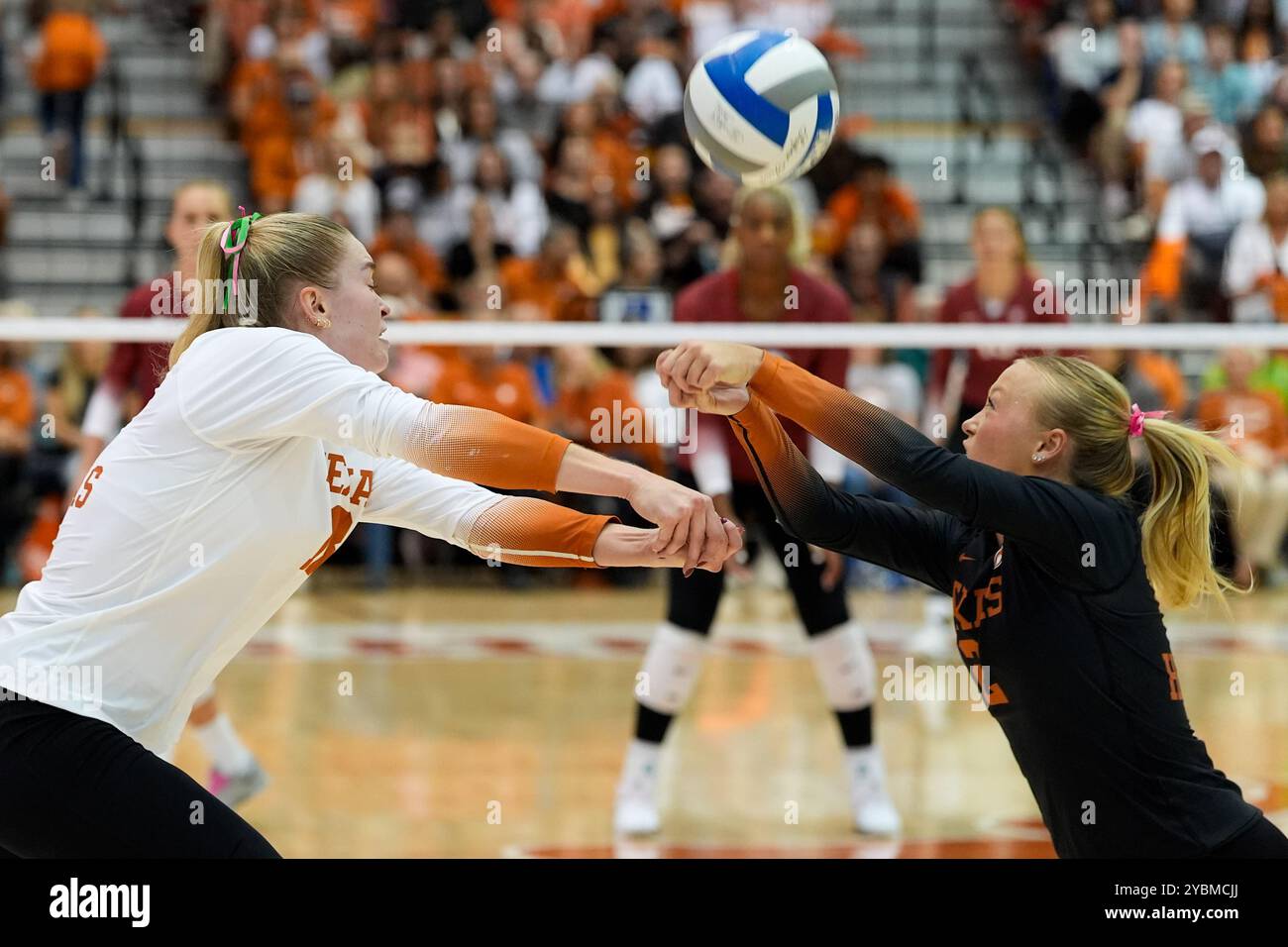 Texas outside hitter Madisen Skinner (6) and libero Emma Halter (2 ...