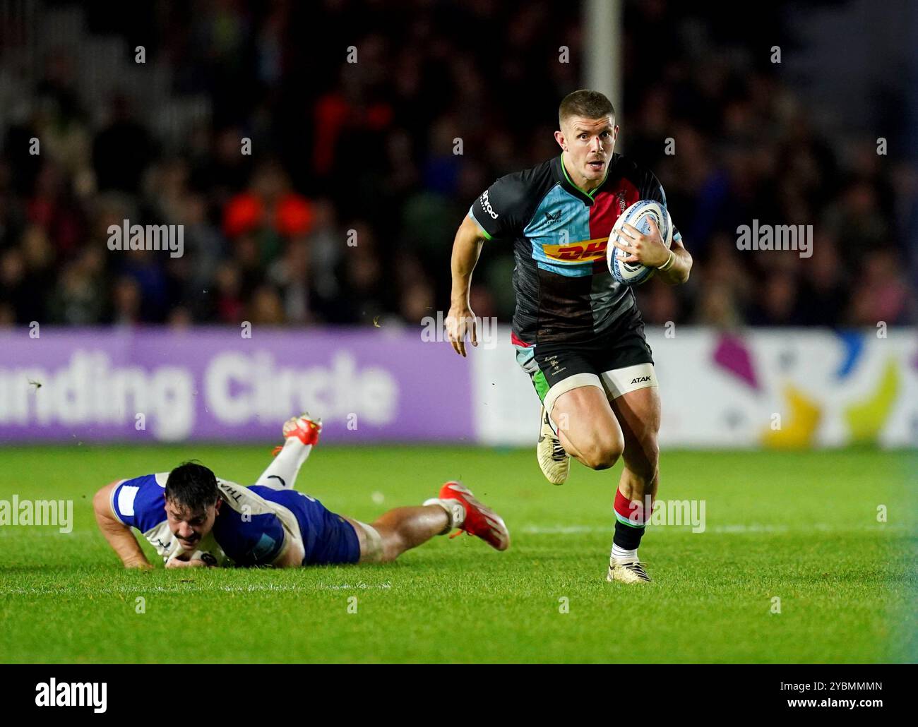 Harlequins' Luke Northmore (right) evades a tackle from Bath's Jaco ...